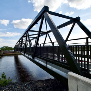 Video: New pedestrian and cycle bridge installed over Black Cart river ...